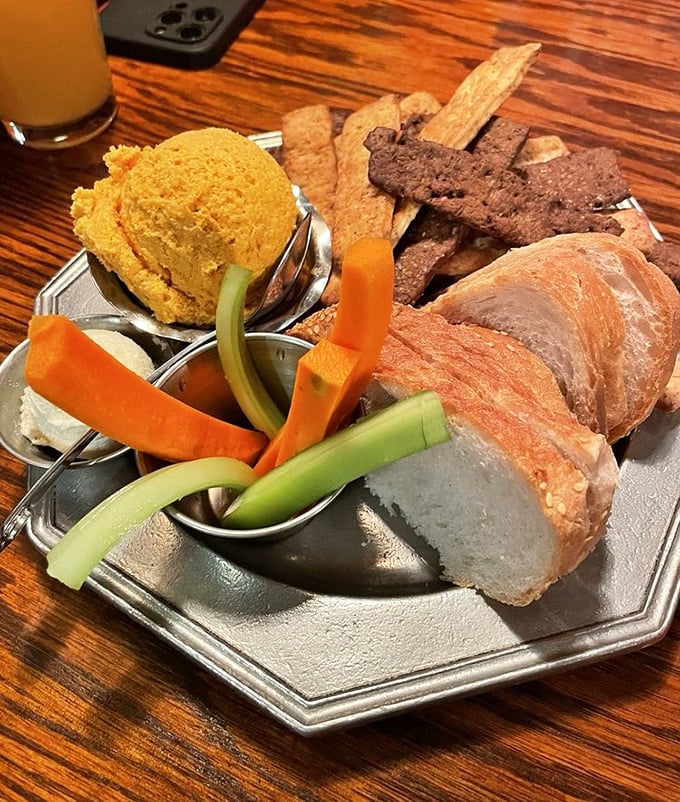 This appetizer platter features their famous cheese spread alongside fresh vegetables and house-made crackers &ndash; a starter that's been delighting guests for generations.