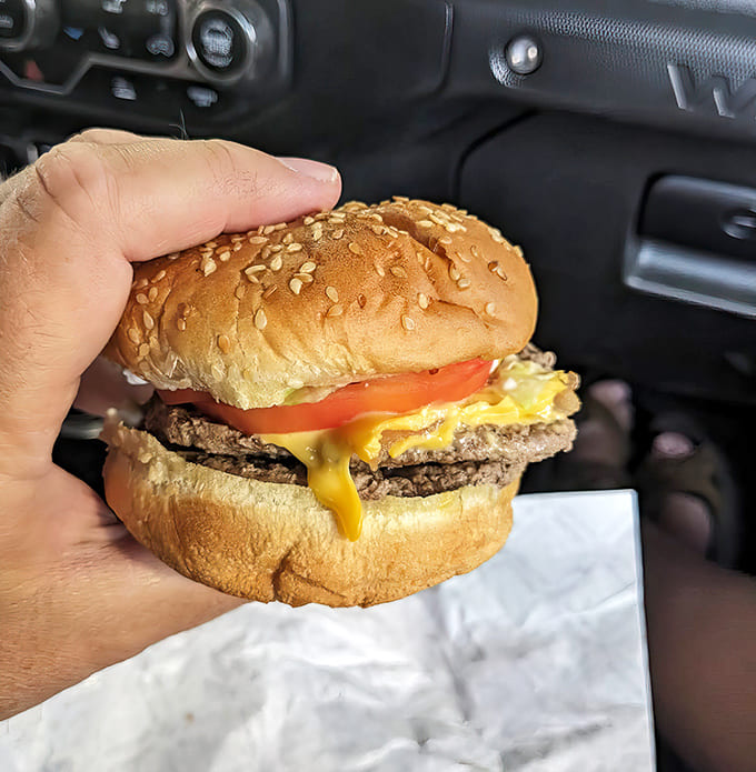 This isn't just any burger &ndash; it's a masterpiece of beef, cheese, and toasted bun that requires both hands and zero shame.