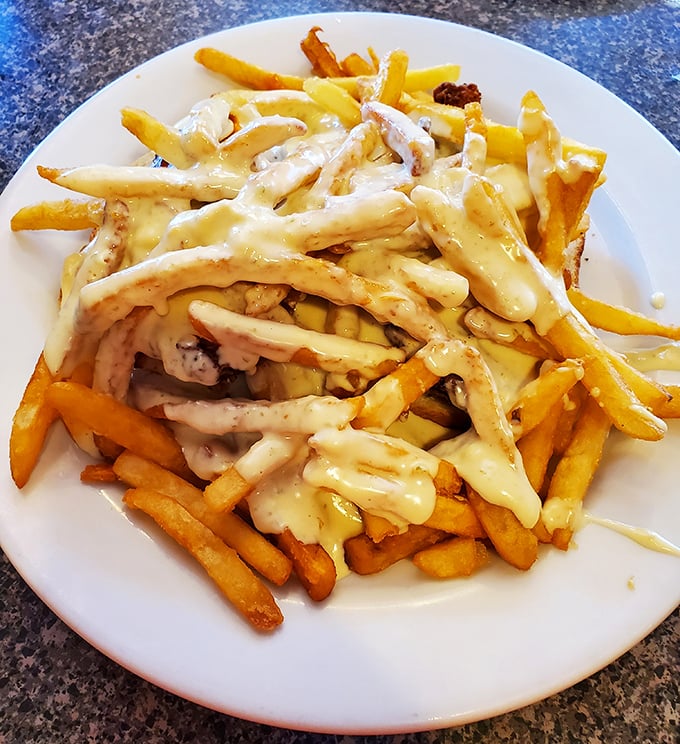 These aren't just cheese fries &ndash; they're a golden, gooey masterpiece that transforms simple potatoes into a symphony of comfort food perfection.