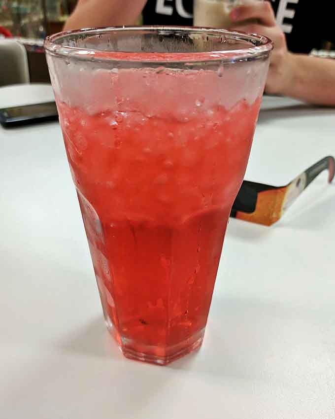 That cherry soda isn't just a drink &ndash; it's a ruby-red time machine that fizzes with memories of simpler times and summer afternoons.