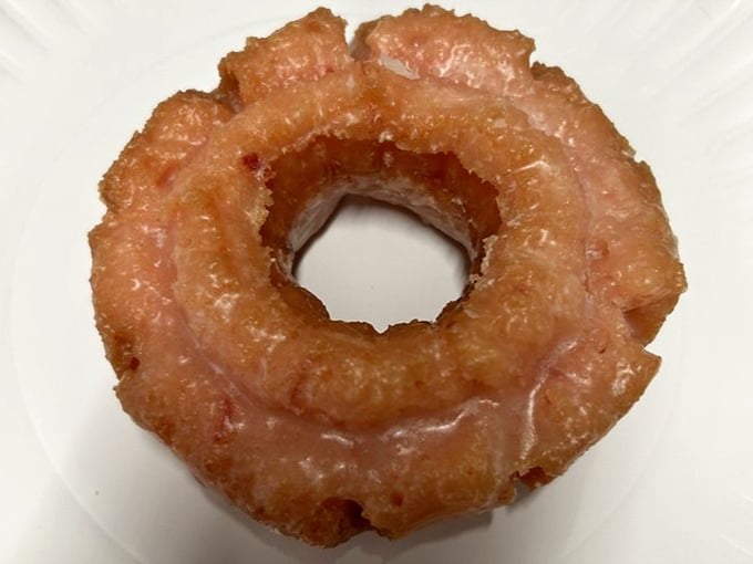 The legendary glazed donut – deceptively simple, impossibly perfect, with a translucent glaze that shatters just right with each heavenly bite.