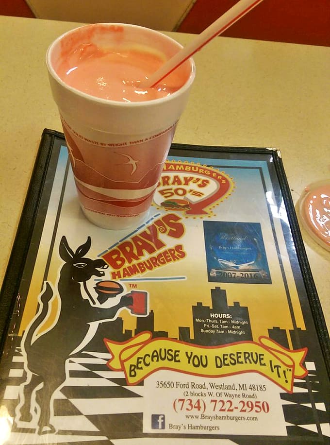 That cherry shake isn't just pink &ndash; it's the color of childhood memories and summer afternoons, served cold in a cup that sweats with anticipation.