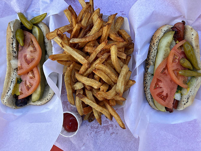 The perfect Chicago meal: two fully-loaded char-dogs flanking golden, crispy fries &ndash; a combination that's kept Chicagoans coming back for decades.
