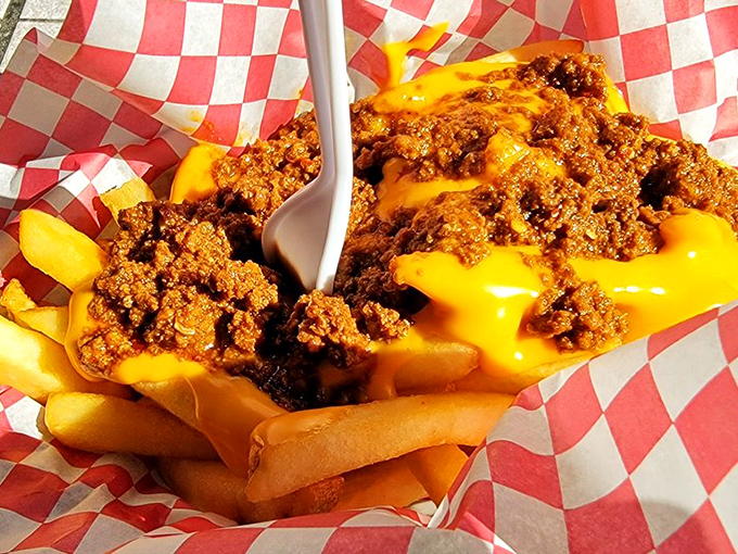 Chili cheese fries that require a fork, a napkin, and possibly a moment of silent appreciation before diving into this glorious mess.