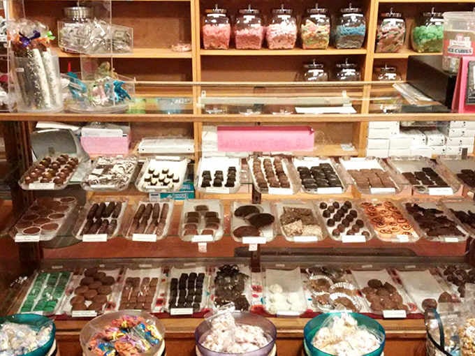 The chocolate display case showcases handcrafted confections that prove chocolate isn't just food, it's art you can eat without feeling guilty about it.