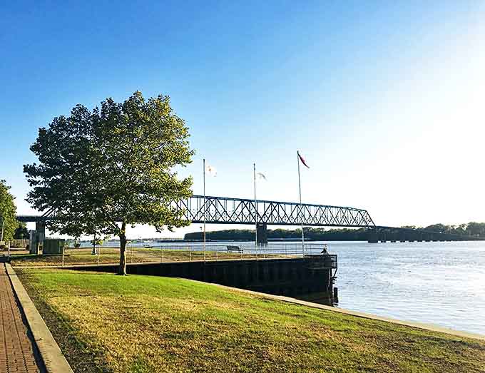 At Clat Adams Bicentennial Park, the Mississippi doesn't just flow by – it performs, with the fountain providing a perfect foreground for river-watching.