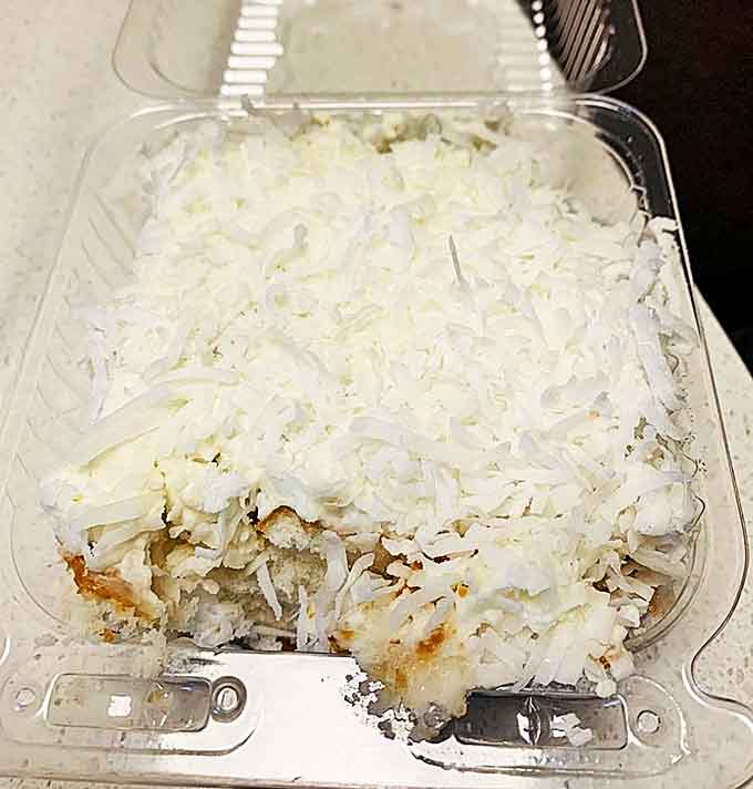 Even in a to-go container, the legendary coconut cake maintains its appeal, ready to be transported to grateful recipients across the country.