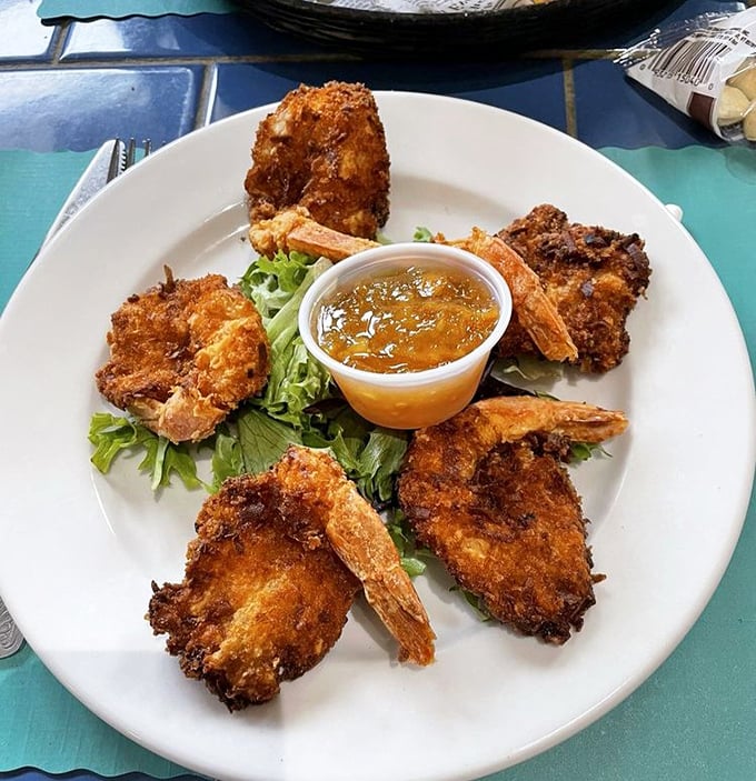 These coconut shrimp aren't just fried &ndash; they're transformed into crunchy crescents of seafood perfection with dipping sauce.