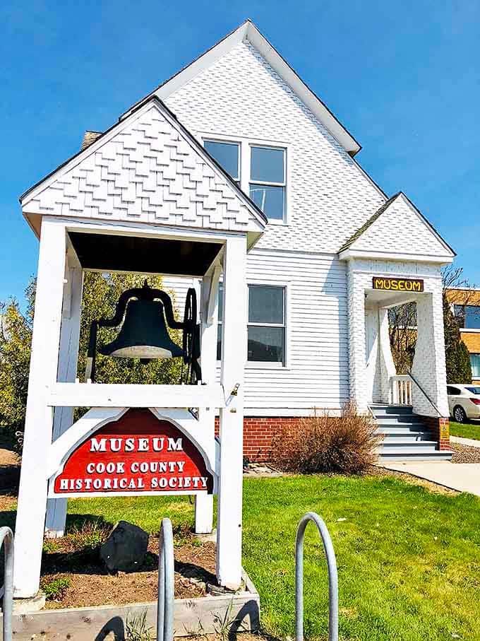 The Cook County Historical Society Museum preserves local stories in a classic white building, complete with a bell that once called the community together.