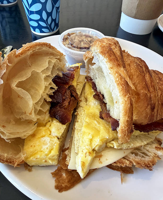 Flaky croissant meets crispy bacon and fluffy eggs in a breakfast sandwich so good it might make you question all your previous life choices.