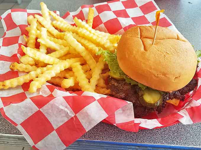 This isn't just a burger &ndash; it's architecture. Layers of beef, cheese, and fresh toppings with crinkle-cut fries standing guard.