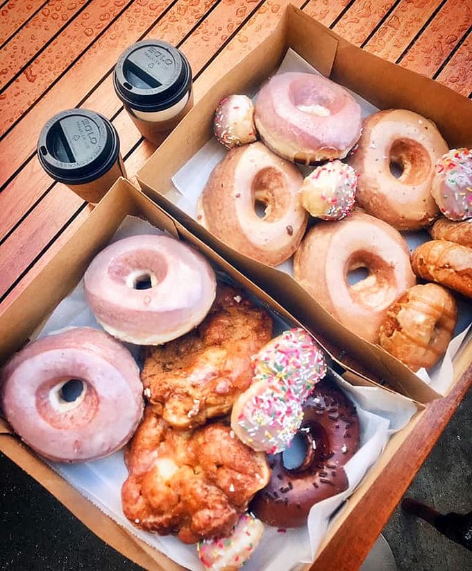 The perfect morning duo captured in cardboard and plastic, because great donuts deserve equally great cold brew companions.