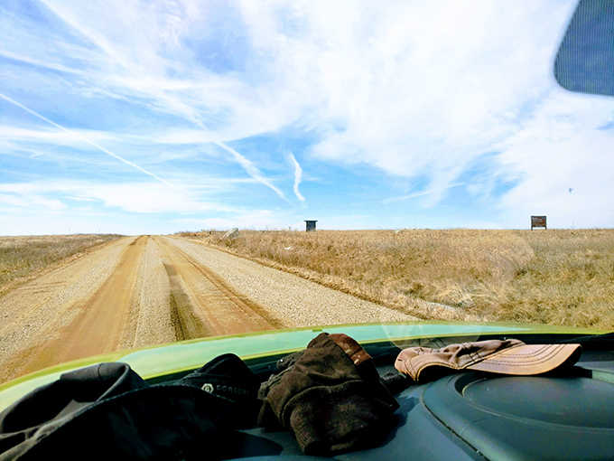 The road less traveled: A simple dirt path leads adventurers into the heart of Touch the Sky Prairie, where modern worries fade with each step.