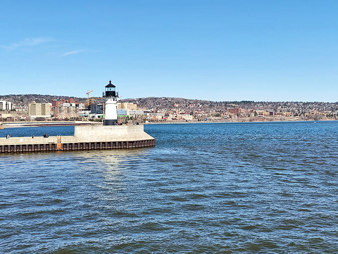 The Duluth Harbor North Pier Light stands sentinel at the lake's edge, a photogenic landmark that's witnessed countless ships, storms, and selfies through the decades.