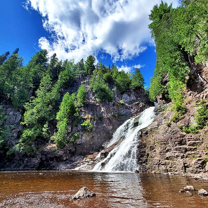 Sunlight dances across Caribou Falls as it tumbles dramatically down ancient rock faces. Nature's own water feature puts any human-made fountain to shame.
