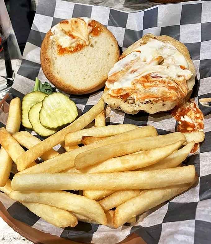 The Firebird chicken sandwich comes perfectly crisp and juicy, accompanied by golden fries that somehow maintain their crunch until the last bite.