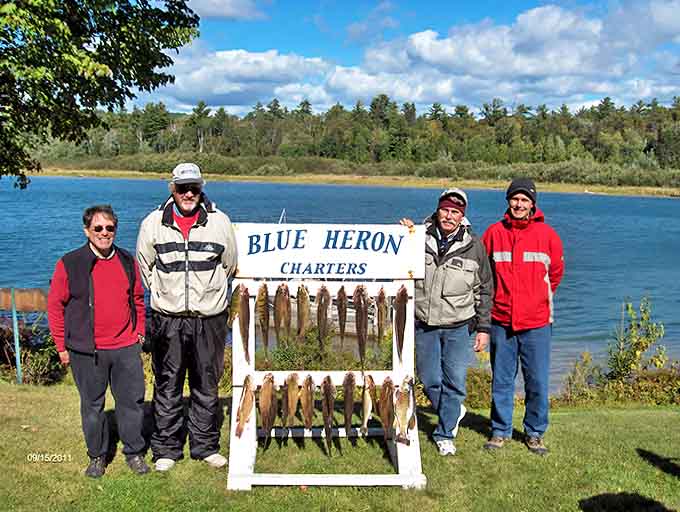 Nothing says "we found the good spot" quite like a group of happy anglers with their catch displayed like trophies.