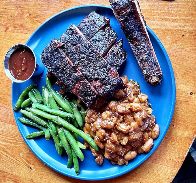 These ribs don't just fall off the bone &ndash; they practically leap with joy, their smoky exterior giving way to meat that redefines tenderness.