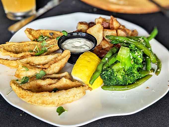 Crispy fried smelt arrives with perfectly steamed vegetables and roasted potatoes &ndash; a Great Lakes tribute that tastes like vacation memories.