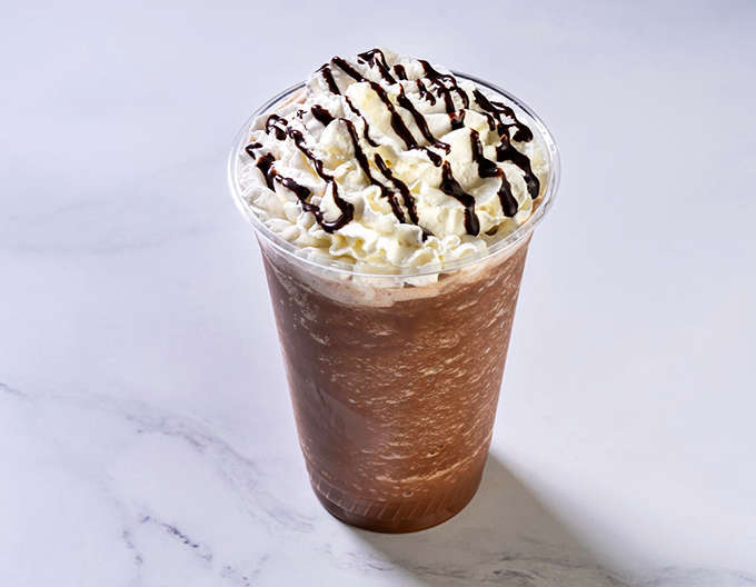 The frozen frappe &ndash; where coffee meets dessert in a tall glass of "why choose between caffeine and sugar when you can have both?"