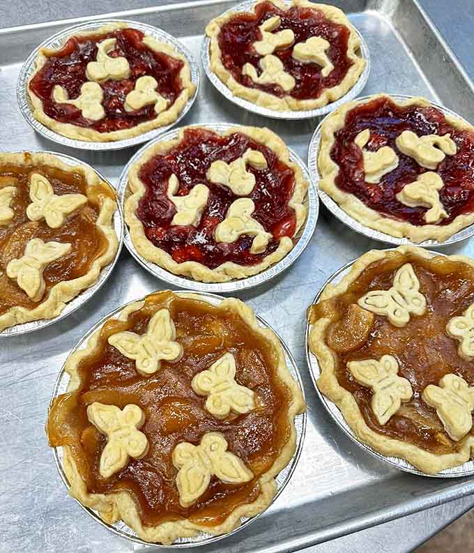 Fruit pies adorned with delicate butterfly cutouts prove that sometimes the tastiest things come dressed in the prettiest packages.