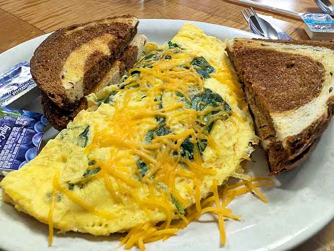 The Gardener's omelet bursts with fresh vegetables and melted cheese, proving that healthy choices can still be indulgent. That marble rye toast deserves its own fan club!