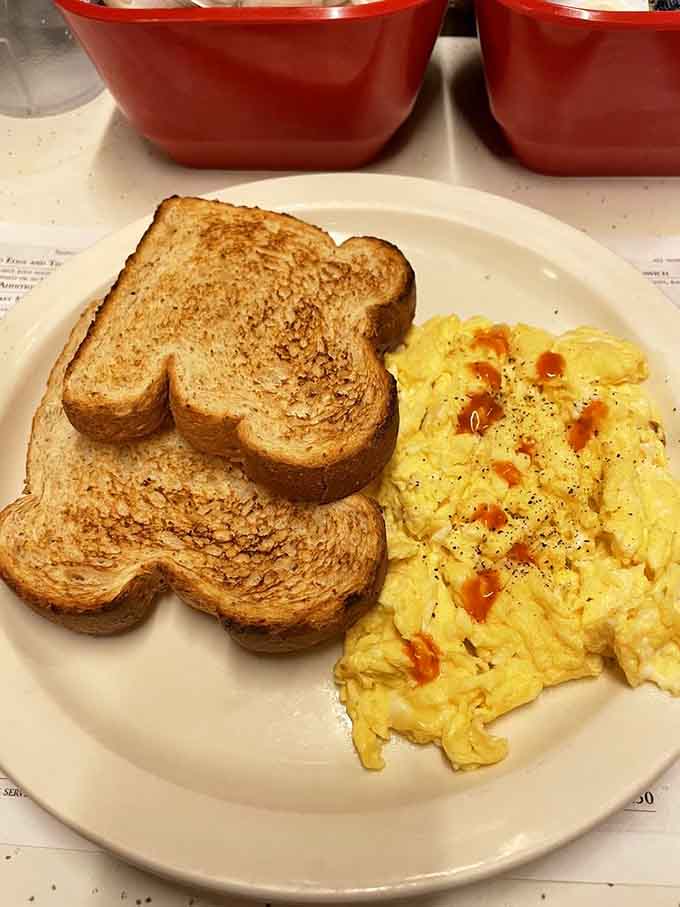 Scrambled eggs and wheat toast proving that sometimes the classics are classic for a very good reason, no reinvention needed.