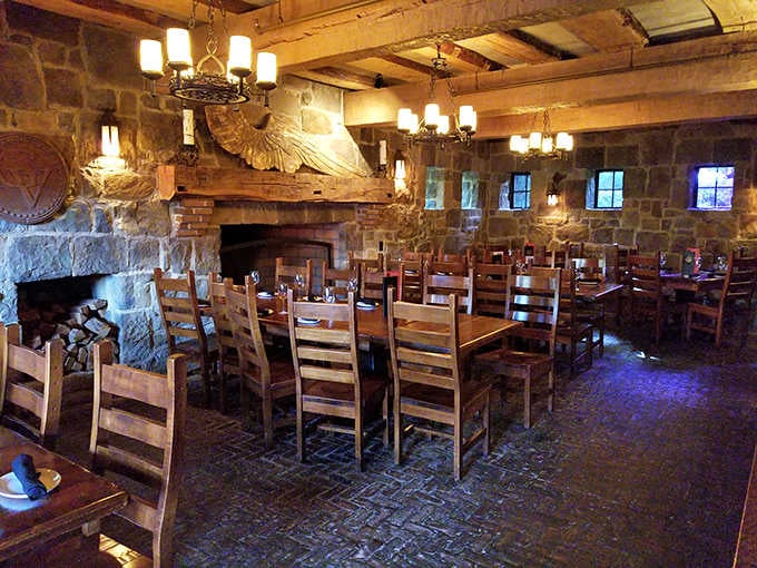Rustic wooden beams frame this intimate dining space where candles flicker, conversations flow, and meals become memories worth savoring long after dessert.