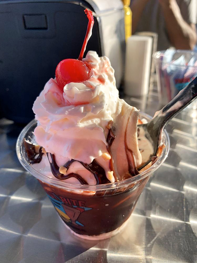 Chocolate rivers flow over vanilla mountains in this hot fudge sundae &ndash; proof that sometimes the classics can't be improved upon.