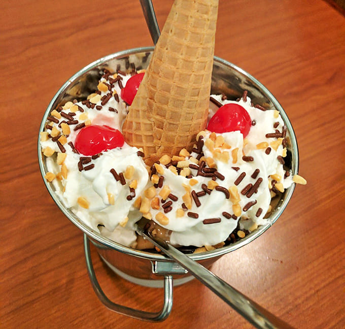 This sundae isn't messing around with that waffle cone standing tall like a delicious flag of victory over boring desserts.
