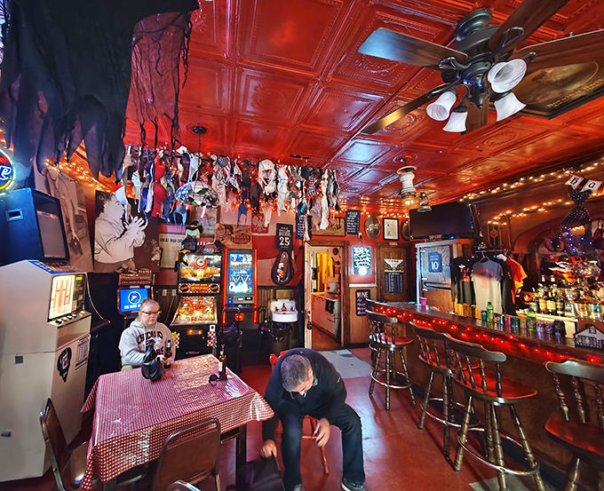 Bowlers chat between frames in the bar area, where vintage decor and memorabilia create an atmosphere no corporate chain could ever replicate.