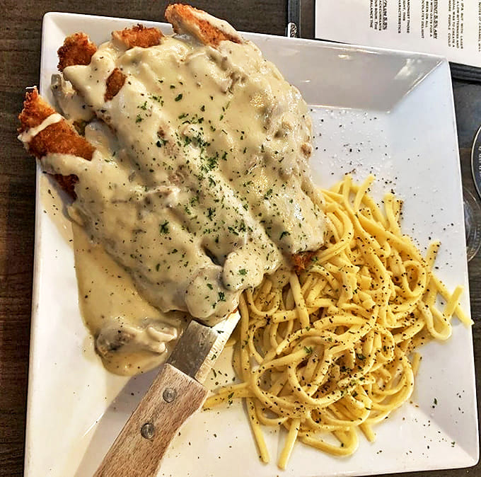 German comfort food gets the Midwest treatment &ndash; a crispy pork cutlet swimming in mushroom gravy that's practically drinking material.