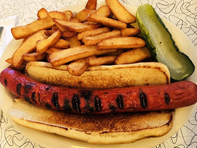 The classic hot dog and fries combo gets the Howley's treatment &ndash; perfectly grilled, nestled in a soft bun, with crispy fries and a pickle.