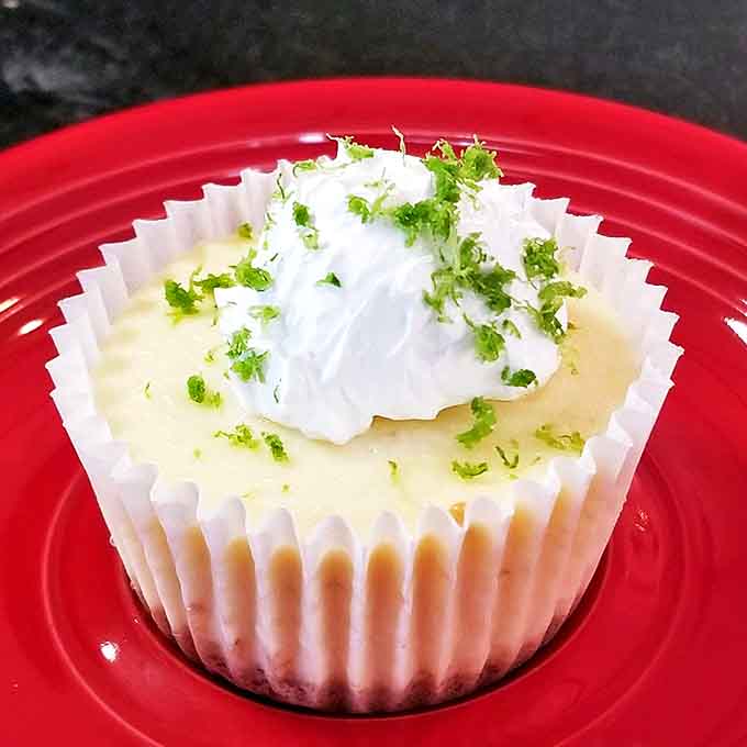 Key lime cheesecake that transports you straight to Florida&mdash;zesty, bright, and topped with a cloud of whipped cream and lime zest.