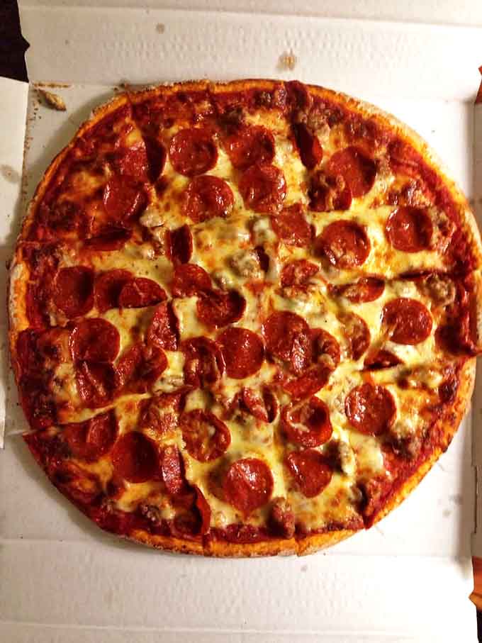 Pepperoni that curls into crispy cups and house-made sausage with visible spices &ndash; this isn't your average meat-topped pie.