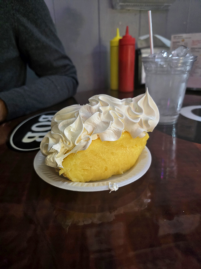 The lemon meringue pie stands tall and proud, its cloud-like topping perfectly browned and hiding a filling that balances sweet and tart.