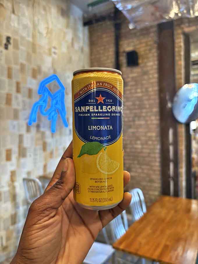 San Pellegrino Limonata &ndash; because sometimes the perfect reading companion isn't coffee but a sparkling citrus refreshment that won't spill on precious pages.