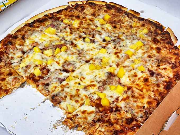 The BBQ pork pizza combines tender, slow-cooked meat with sweet pineapple chunks. It's like a Hawaiian plate lunch reimagined as a pizza &ndash; a delicious cultural mashup.