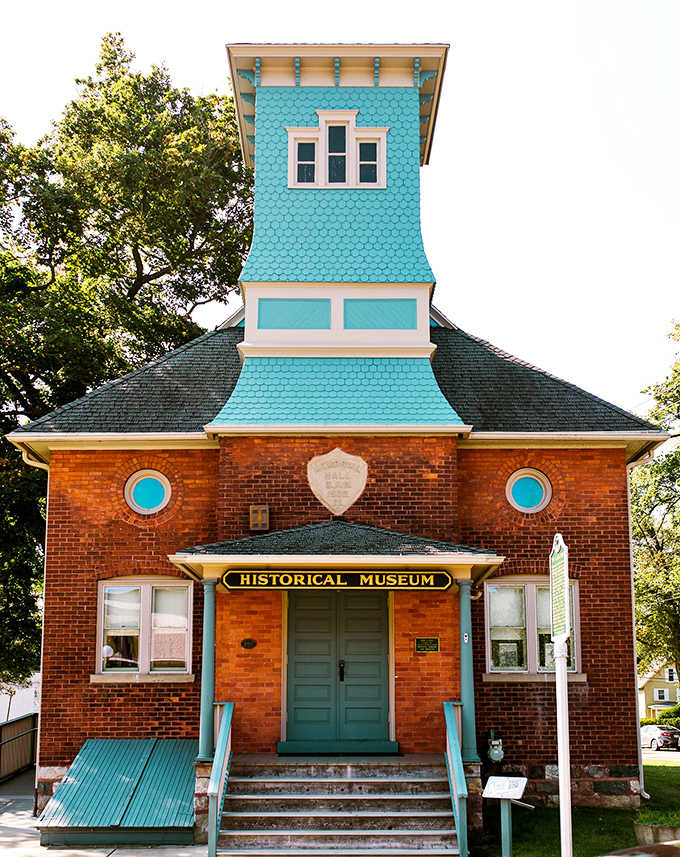 The Marshall Historical Museum's turquoise tower pops against brick walls, a whimsical touch to serious history.