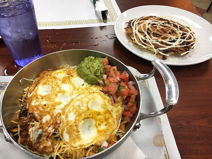 Breakfast skillet heaven: where eggs, cheese, and perfectly seasoned ingredients come together in cast-iron harmony.