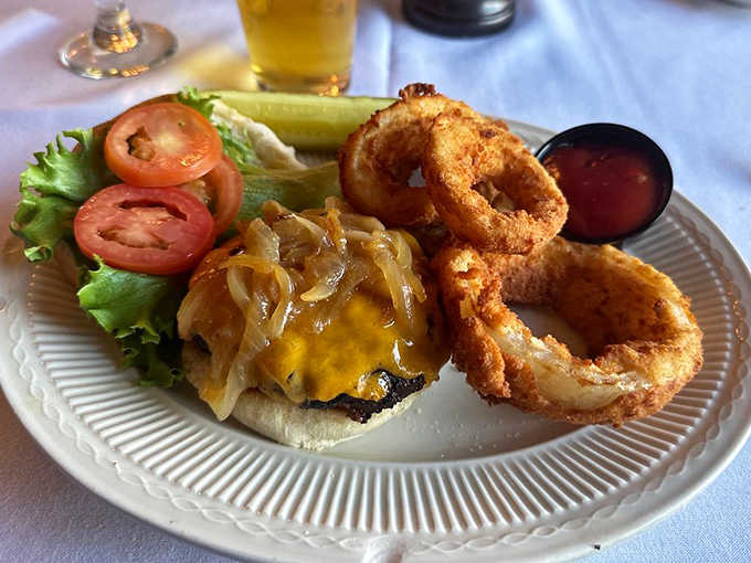 The Napoleon Bacon Burger arrives like royalty &ndash; hand-formed beef patties crowned with applewood smoked bacon and Wisconsin cheddar on a throne of caramelized onions.
