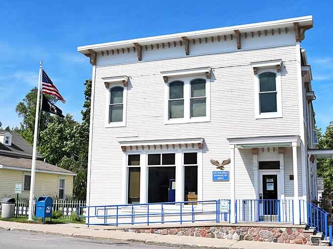 Northport's post office stands as a white-clad sentinel of community connection, where mail and local gossip are exchanged with equal enthusiasm.