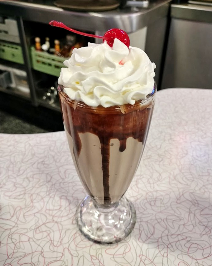 Hot fudge cascades down this old-fashioned milkshake like a chocolate waterfall, topped with a cloud of real whipped cream.
