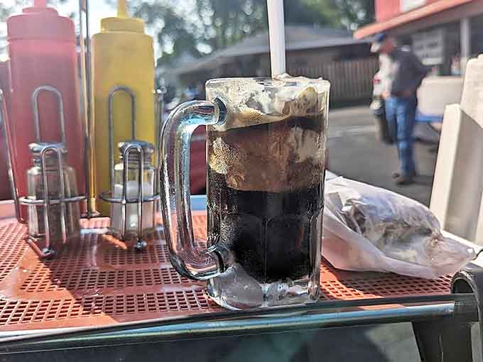 The star attraction arrives: a perfect marriage of creamy vanilla ice cream and house-made root beer creating that frothy layer float aficionados live for.