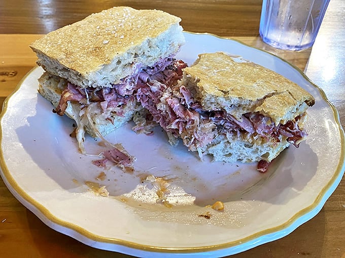 The Reuben reimagined – this isn't your standard deli fare but a carefully crafted flavor bomb that'll ruin all other sandwiches for you.