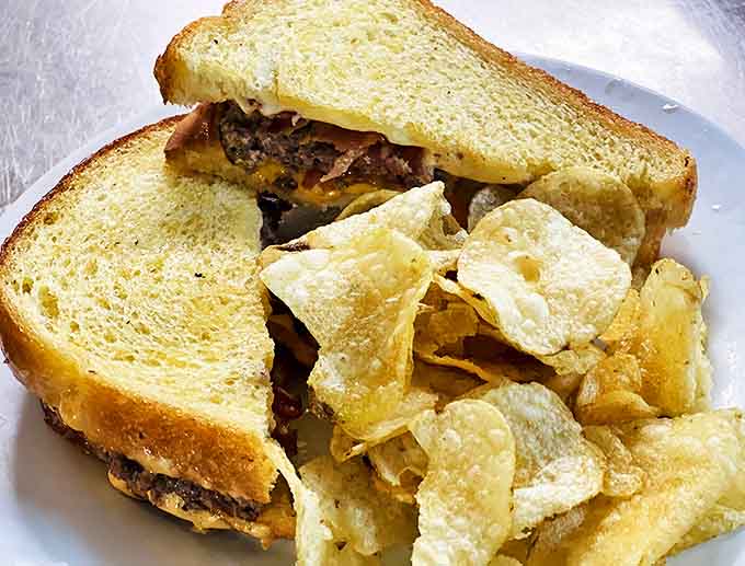 The patty melt &ndash; where perfectly grilled rye bread meets melted cheese and a juicy beef patty in a sandwich that demands a moment of silent appreciation.