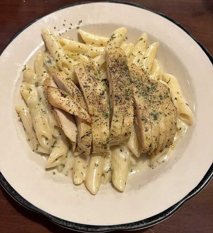 Creamy doesn't begin to describe this Penne Alfredo with grilled chicken &ndash; each perfectly cooked pasta tube wearing a velvety sauce like it was made for it.