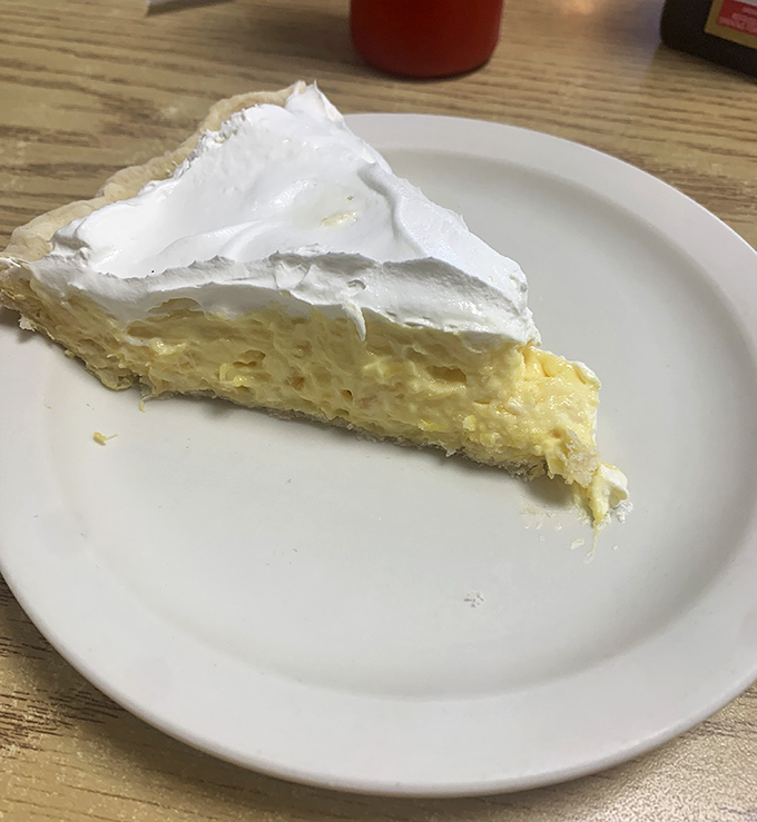 This isn't just pineapple cream pie &ndash; it's a cloud of tropical bliss topped with enough whipped cream to make your cardiologist wince gloriously.