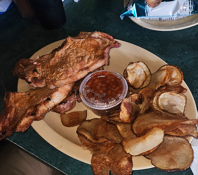 Ribs and homemade chips &ndash; a combination so perfect it should have its own holiday. The crispy potatoes provide the ideal counterpoint.