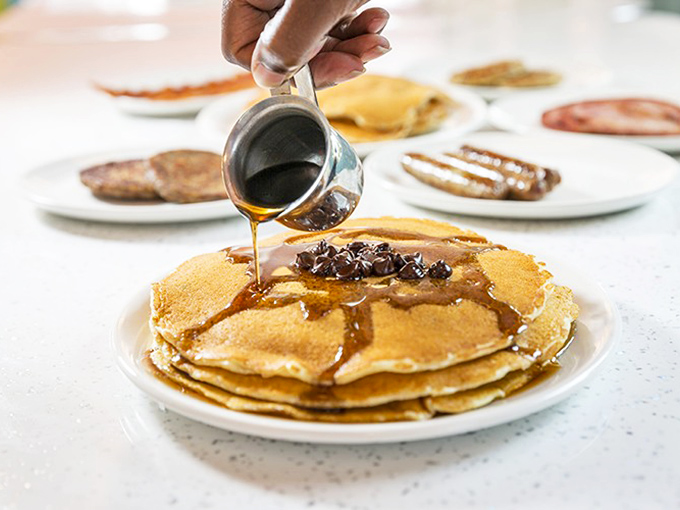 Pouring Syrup: The ceremonial syrup cascade &ndash; that magical moment when amber nectar transforms a stack of pancakes into a breakfast masterpiece worthy of reverence.